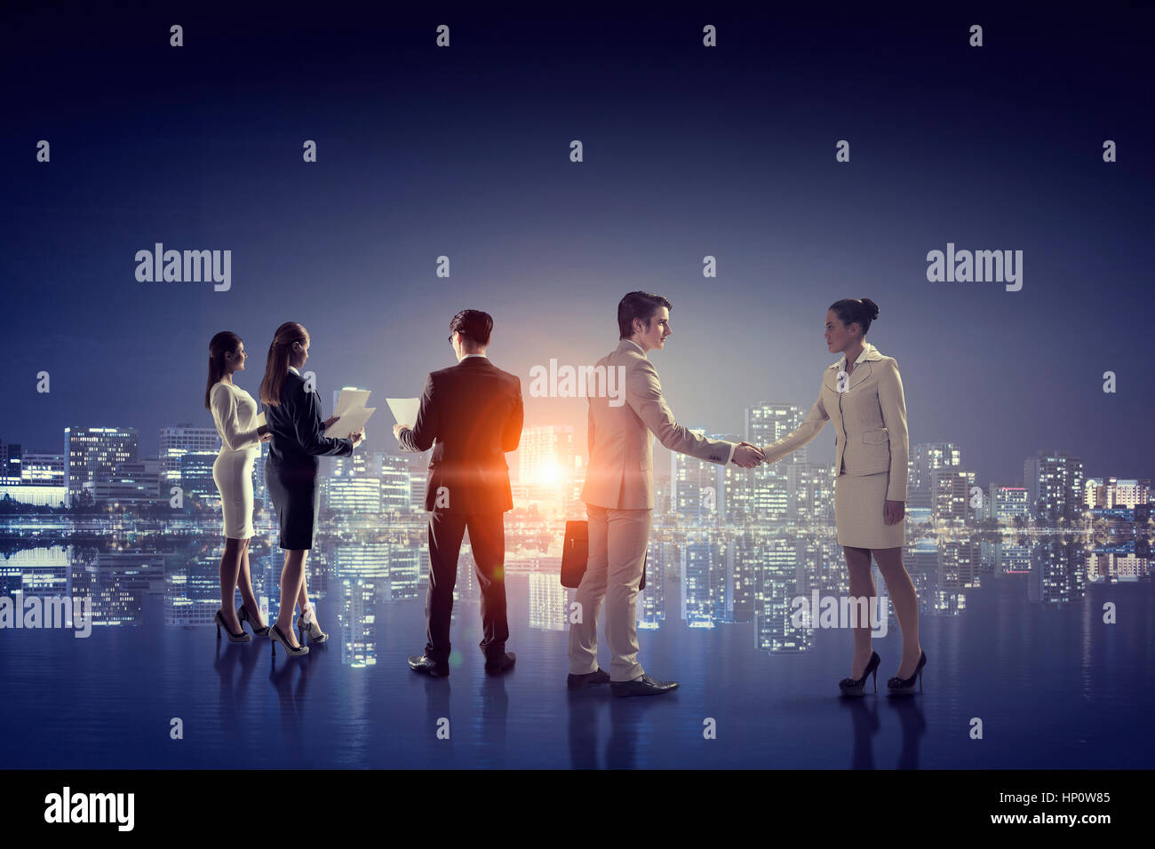 Business handshake with night scene city in background Stock Photo - Alamy