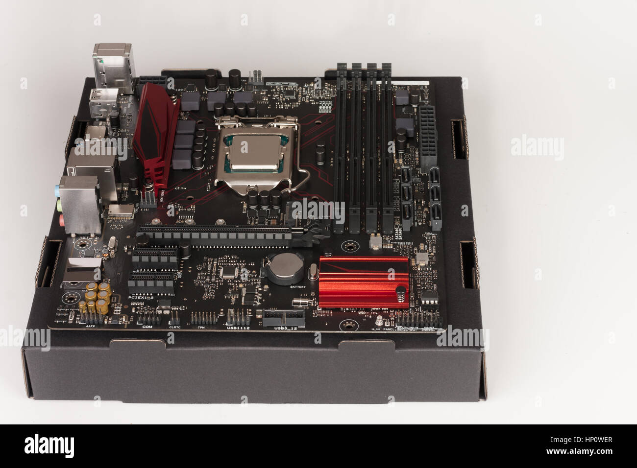 Building of gaming PC, motherboard with installing CPU on black box ...