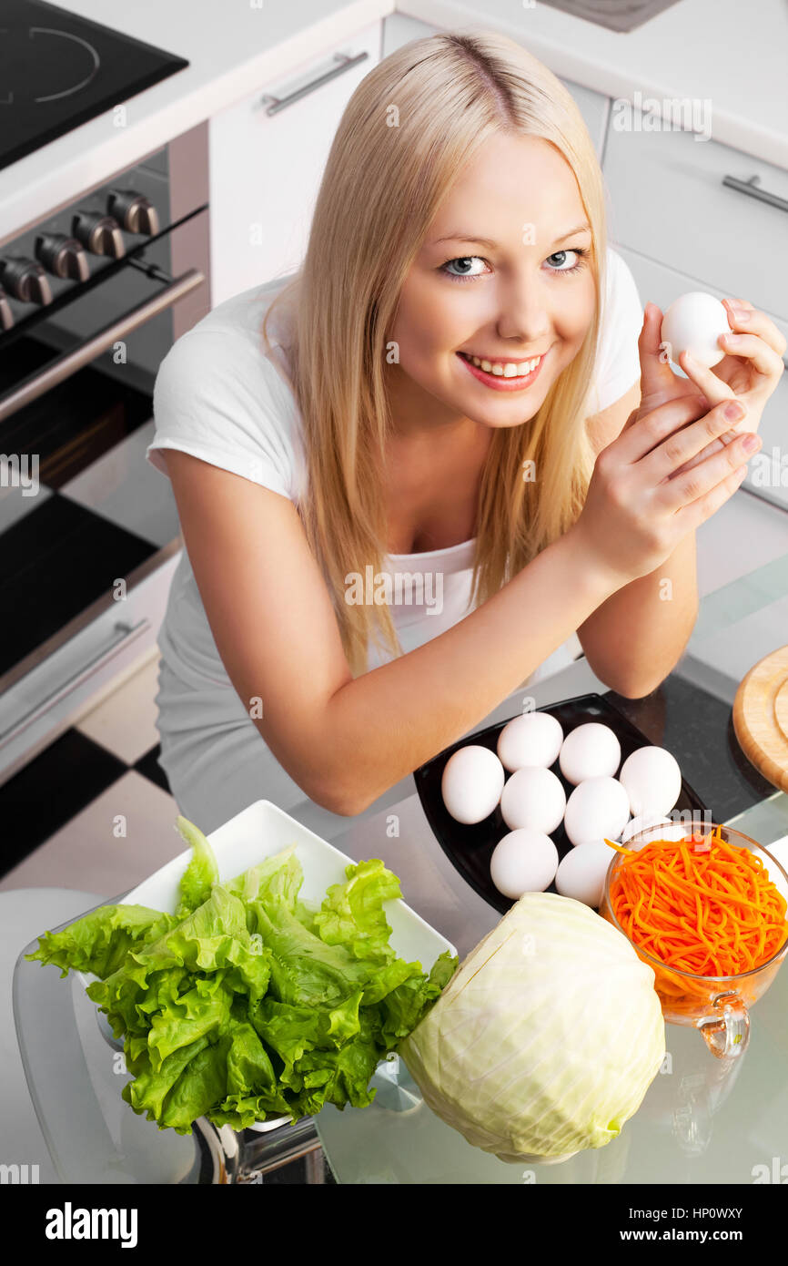 beautiful happy young woman cooking at home Stock Photo - Alamy