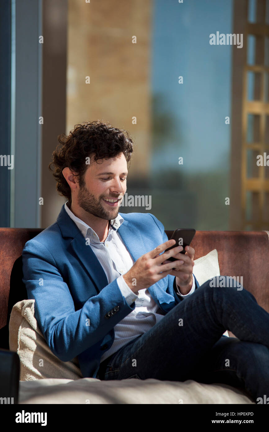 Man text messaging with smartphone Stock Photo - Alamy