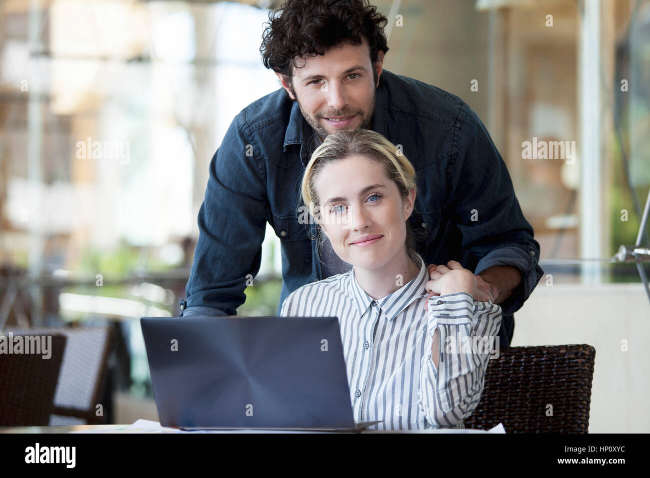 Couple using laptop computer together at home Stock Photo - Alamy