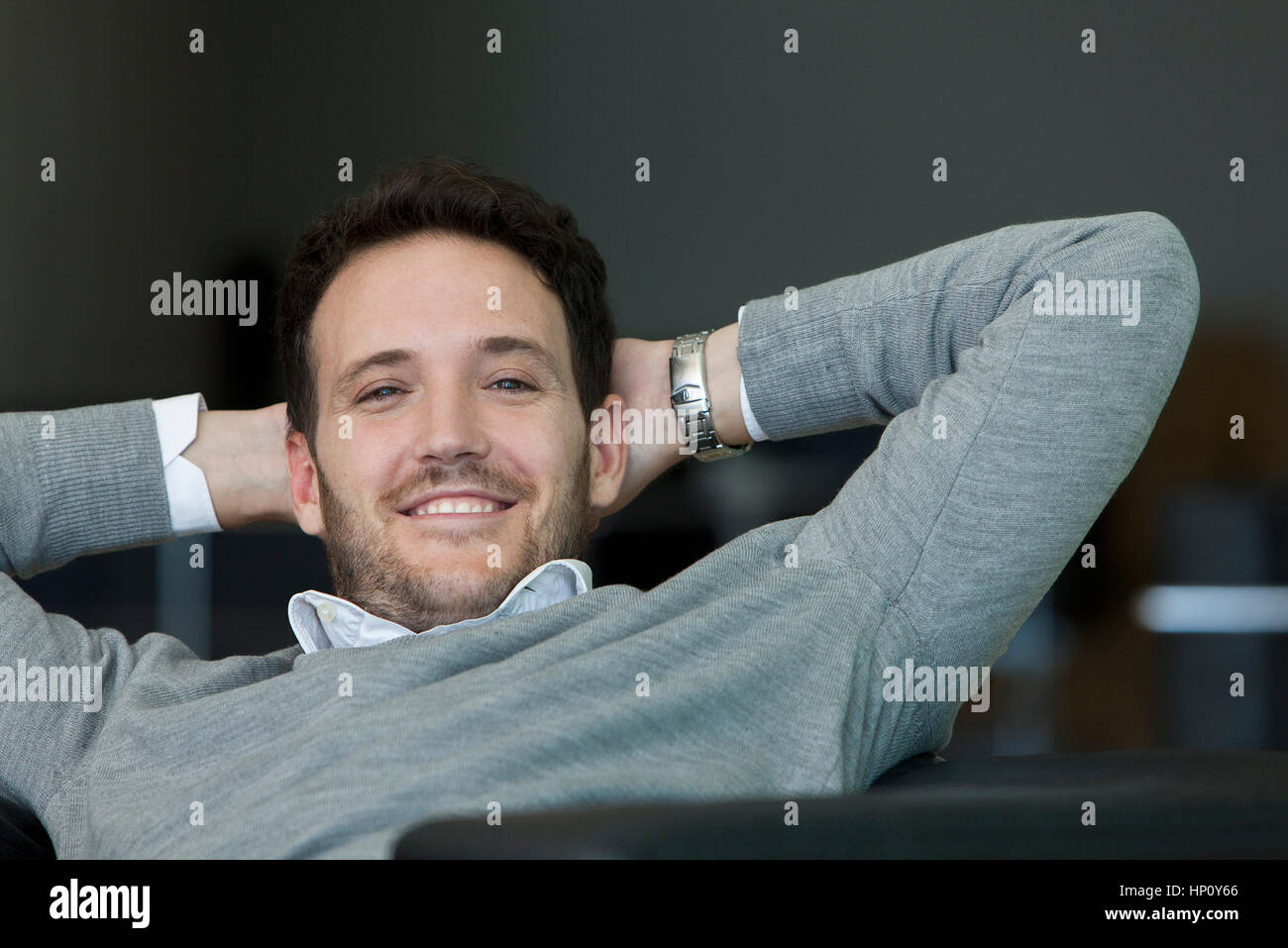 Grinning behind his back hi-res stock photography and images - Alamy