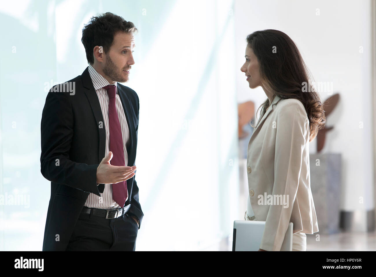 Business partners communicating in office hi-res stock photography and ...