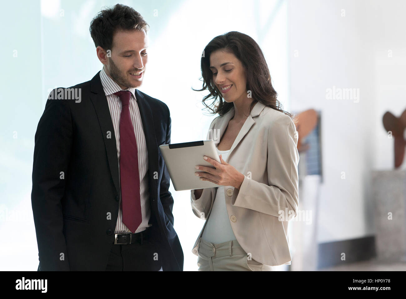 Business associates working together using digital tablet Stock Photo ...