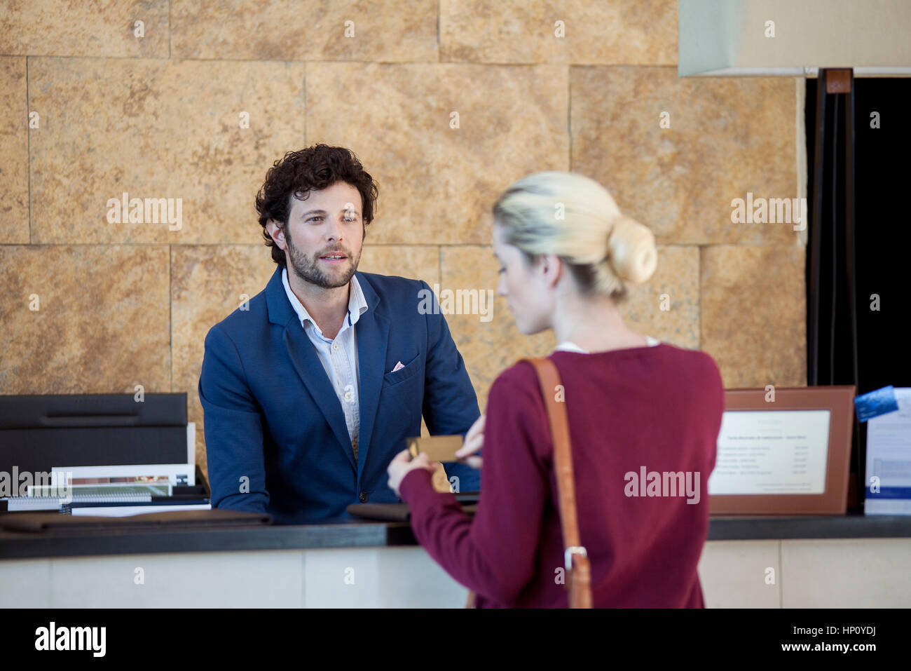 Receptionist works reception desk hi-res stock photography and images ...