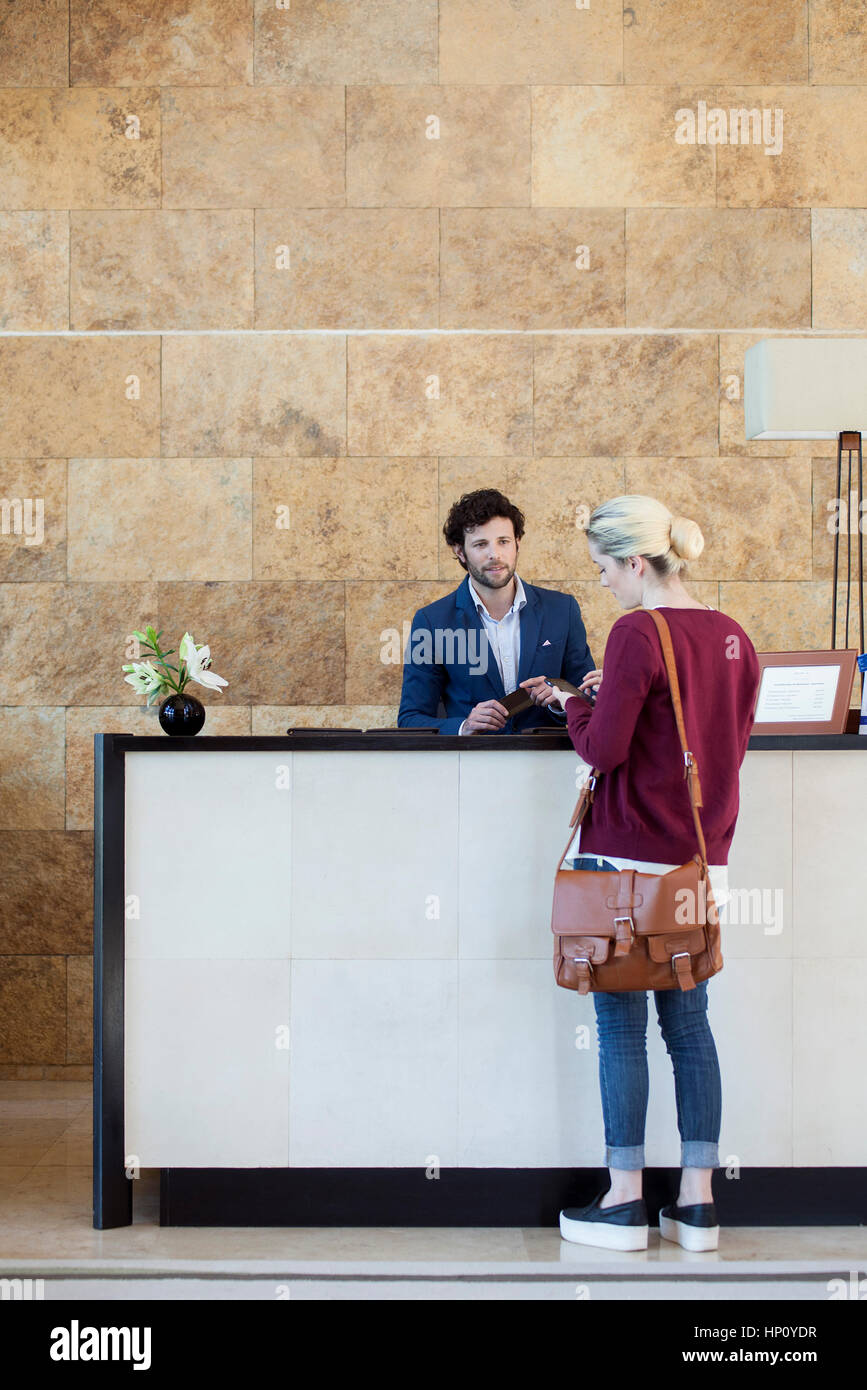 Receptionist hotel full body hi-res stock photography and images - Alamy