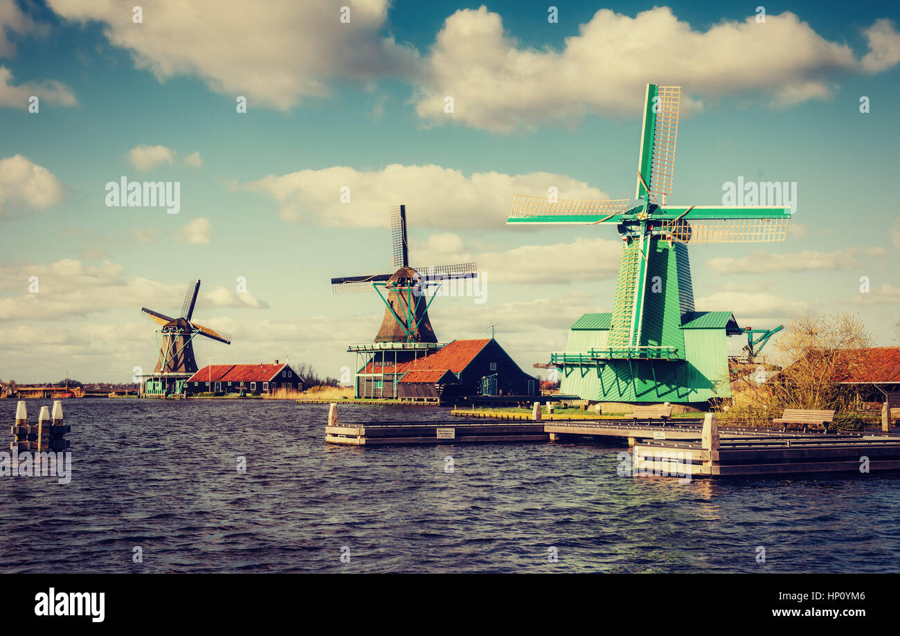 Colorful spring day with traditional Dutch windmills canal in Ro Stock ...