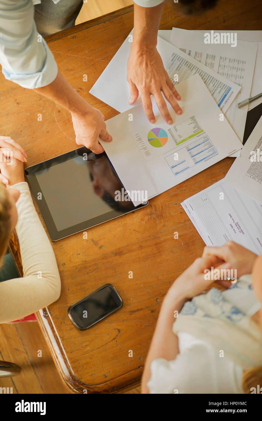 Colleagues collaborating during meeting Stock Photo - Alamy