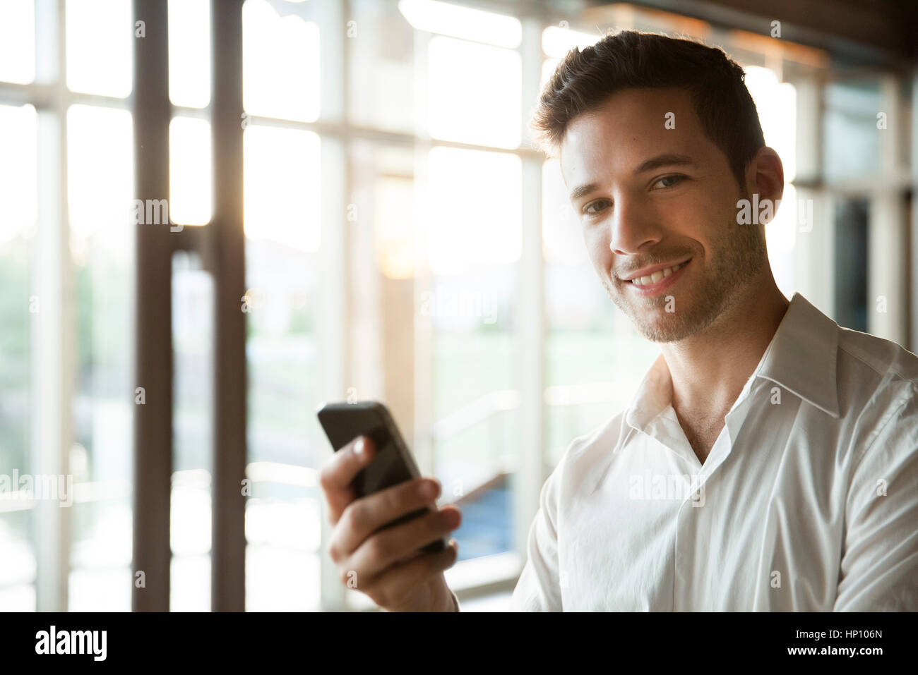 Man using cell phone Stock Photo - Alamy