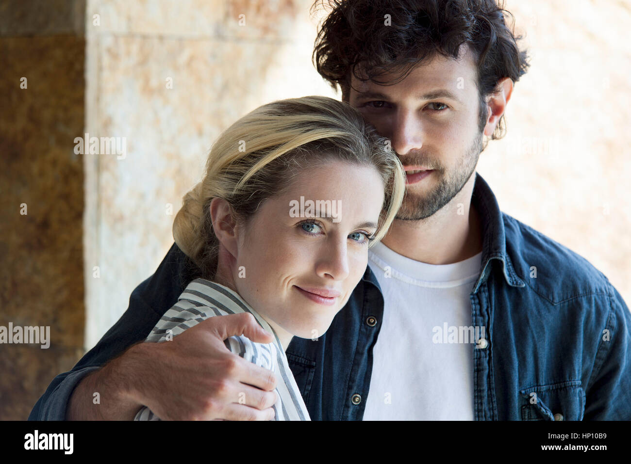 Couple embracing, portrait Stock Photo - Alamy