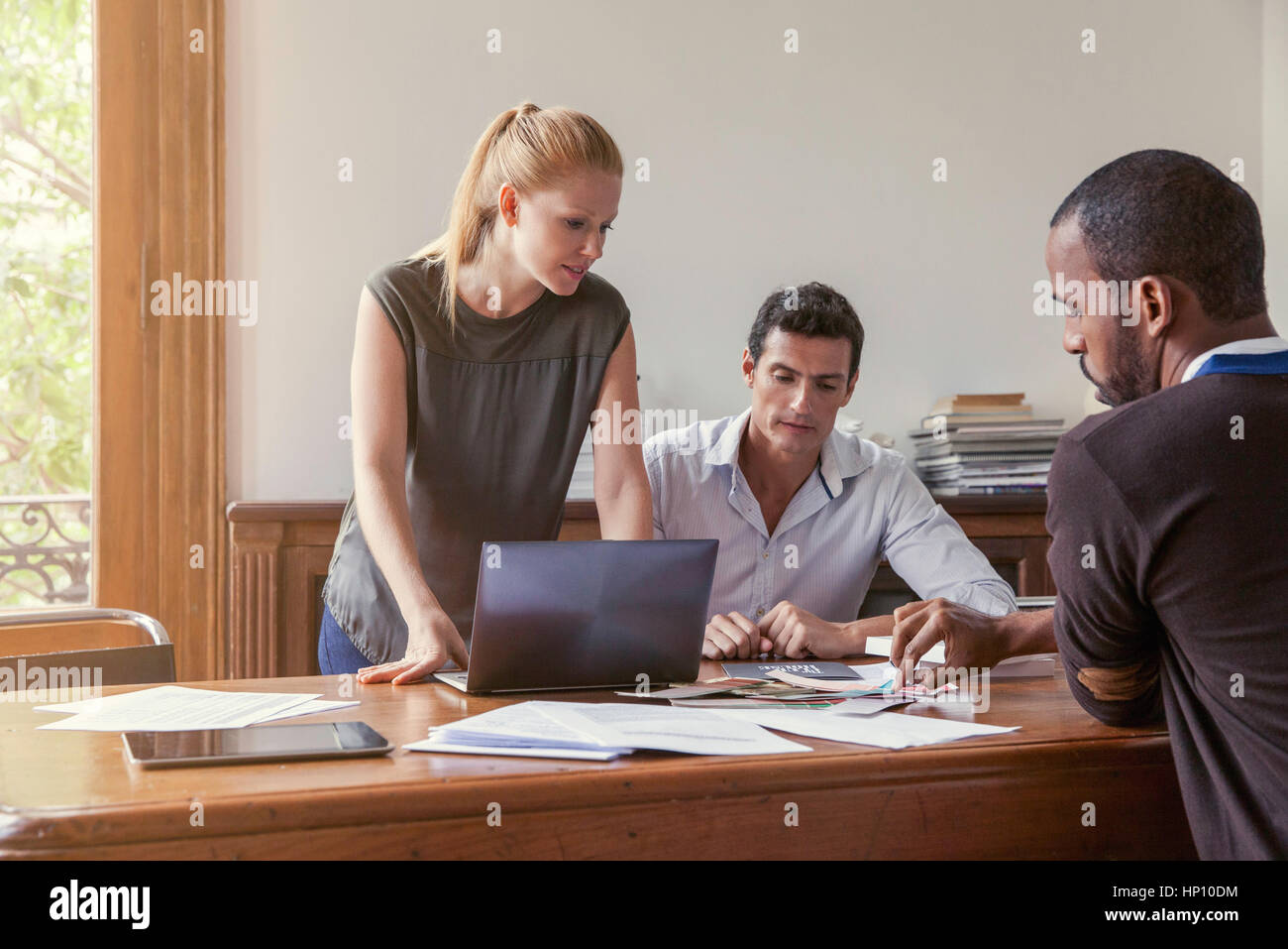 Designers collaborating in office Stock Photo - Alamy