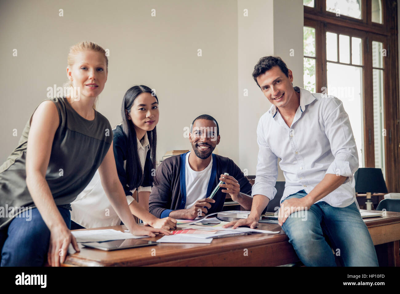 Business partners collaborating in office, portrait Stock Photo - Alamy