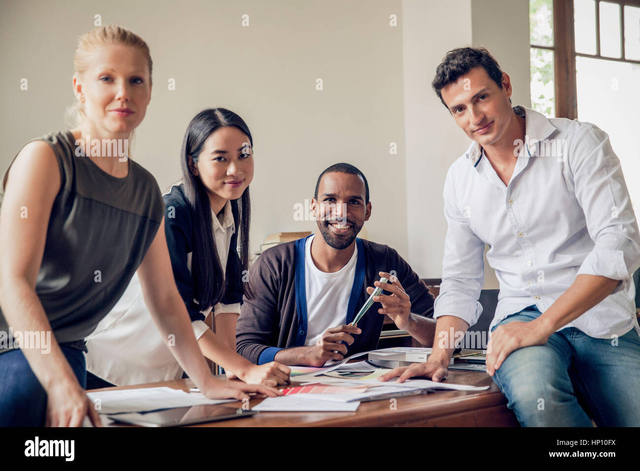 Collaborating four coworkers in hi-res stock photography and images - Alamy