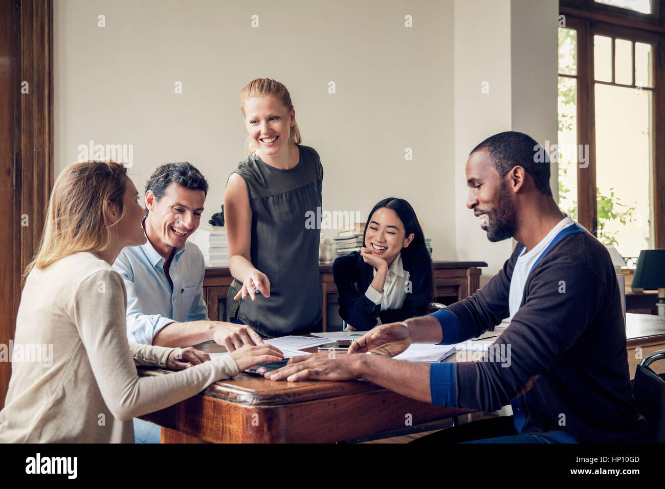 Collaborating five colleagues in hi-res stock photography and images ...