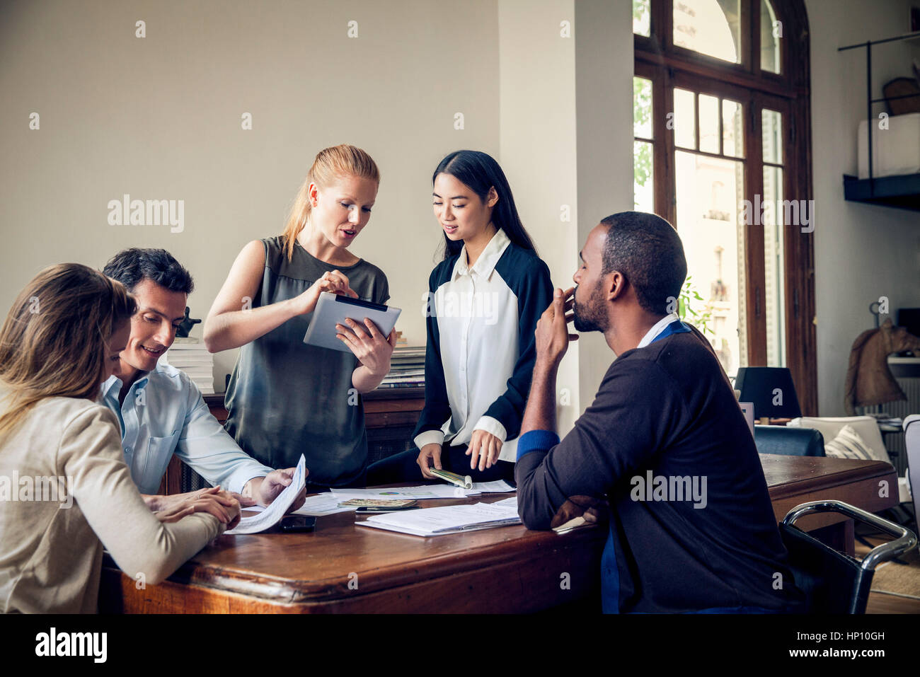 Collaborating five colleagues in hi-res stock photography and images ...