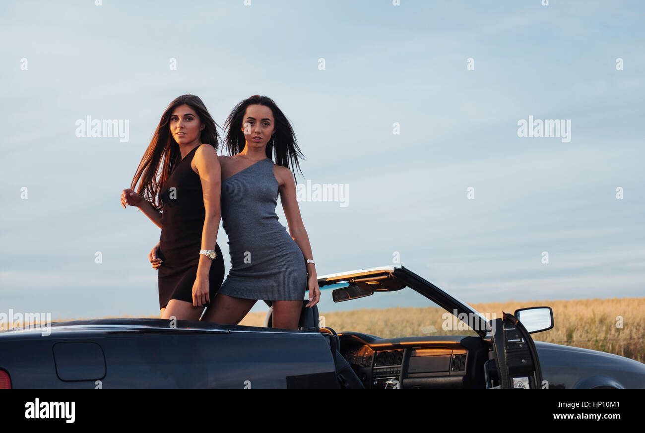 Two women in a black car on the roadside roads Stock Photo - Alamy