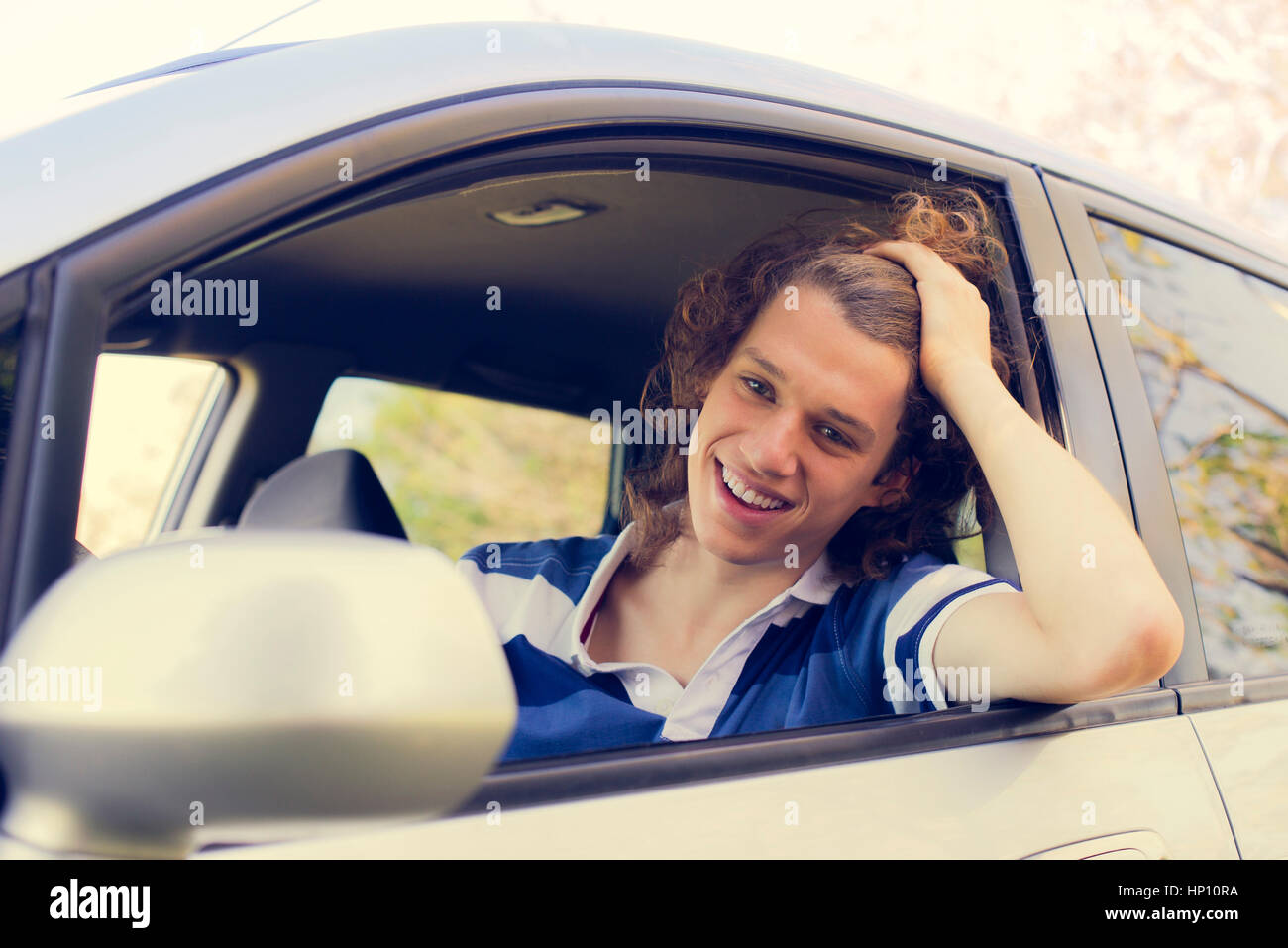 Driver checking side-view mirror Stock Photo - Alamy