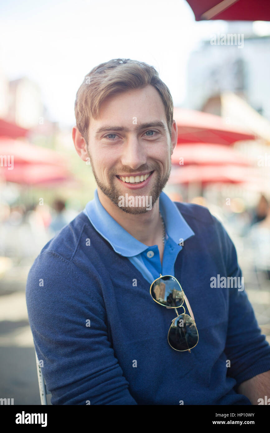 Young man tourist sits on hi-res stock photography and images - Alamy