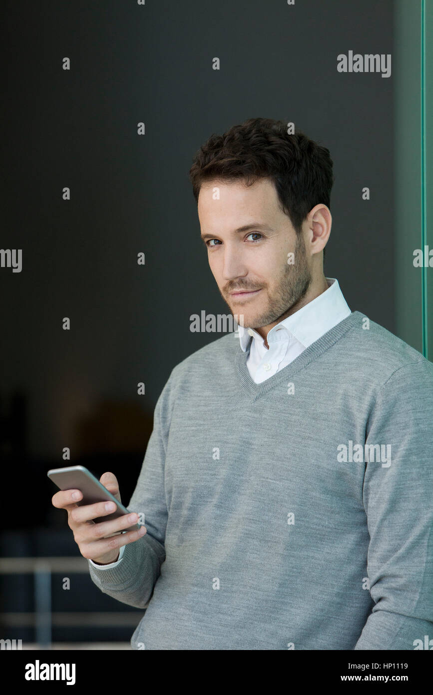Businessman using smartphone Stock Photo - Alamy