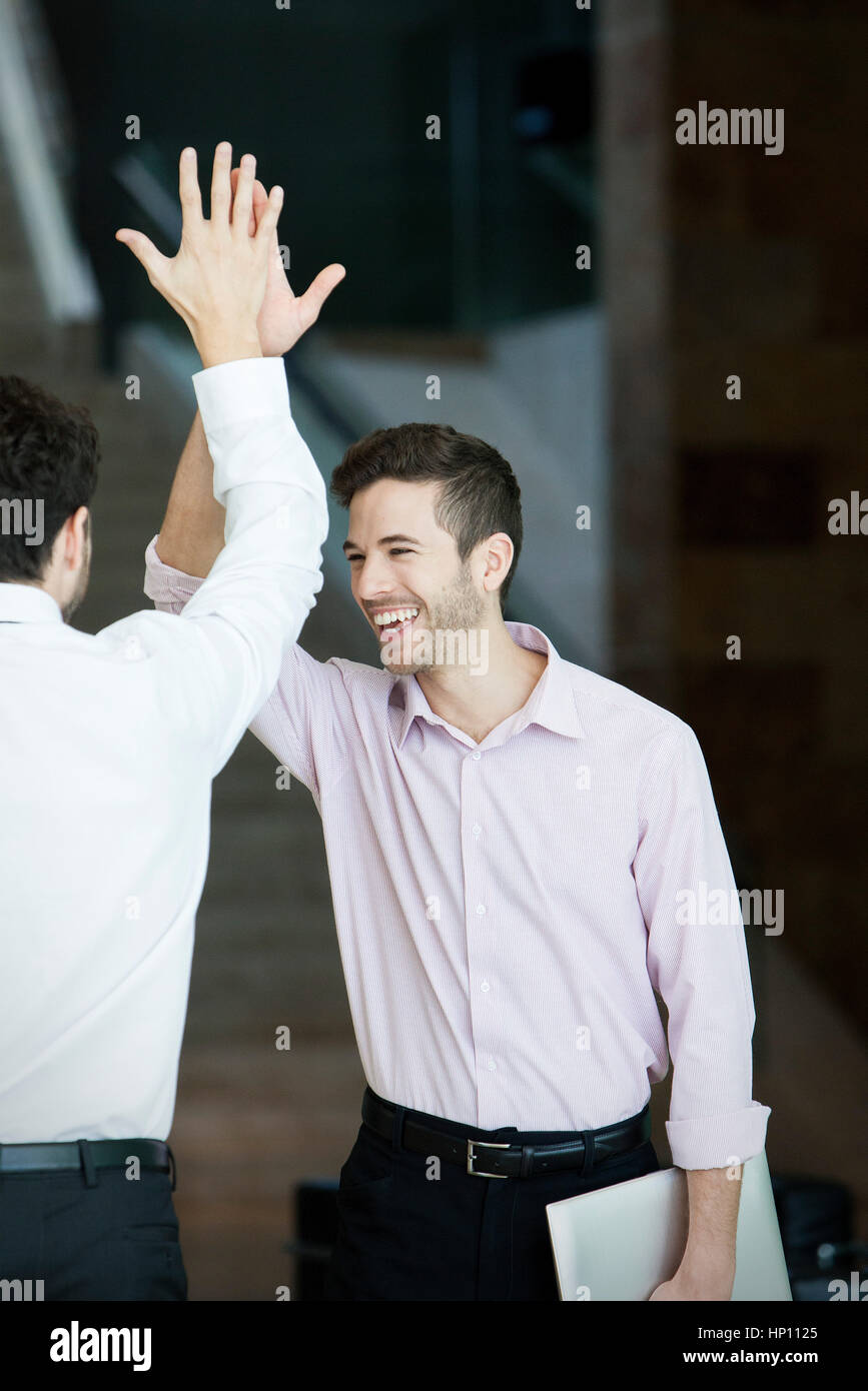 High-five between business colleagues Stock Photo - Alamy