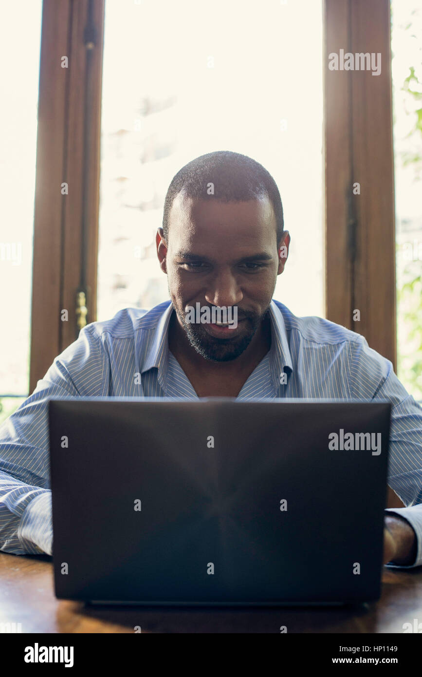Facebook laptop man hi-res stock photography and images - Alamy