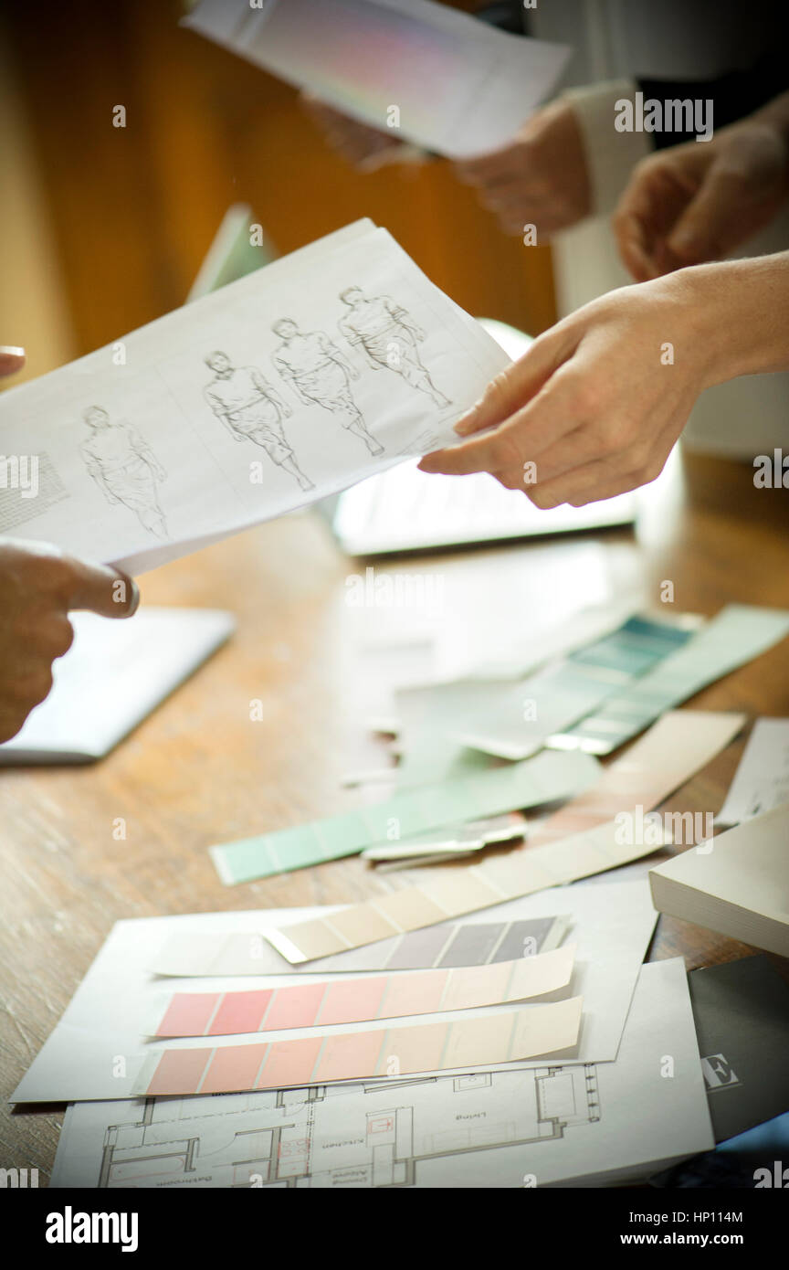 Two people discussing sketch project hi-res stock photography and ...