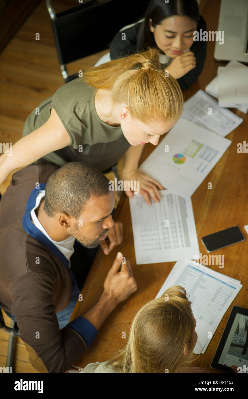 Colleagues collaborating during meeting Stock Photo - Alamy