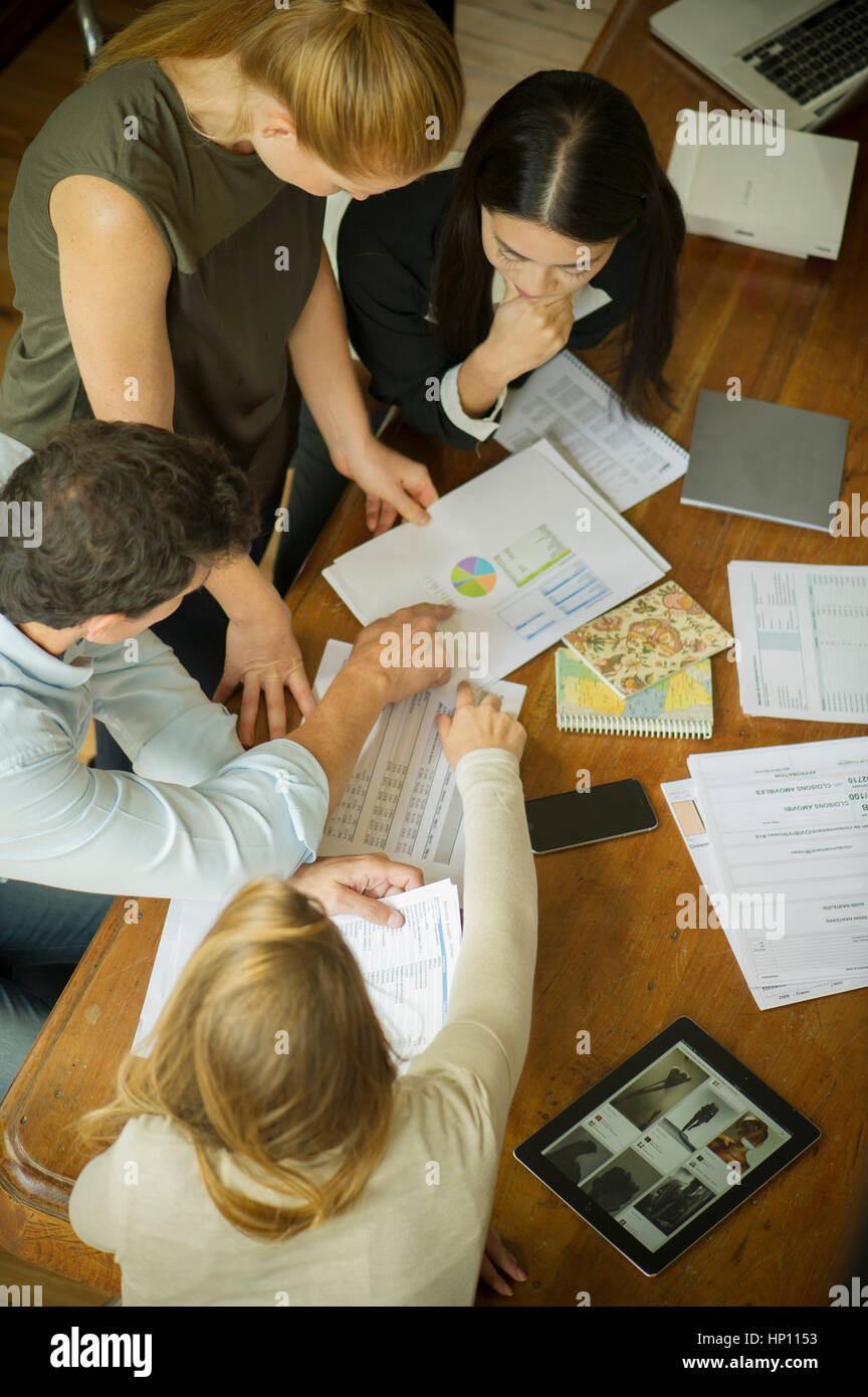 Colleagues collaborating during meeting Stock Photo - Alamy