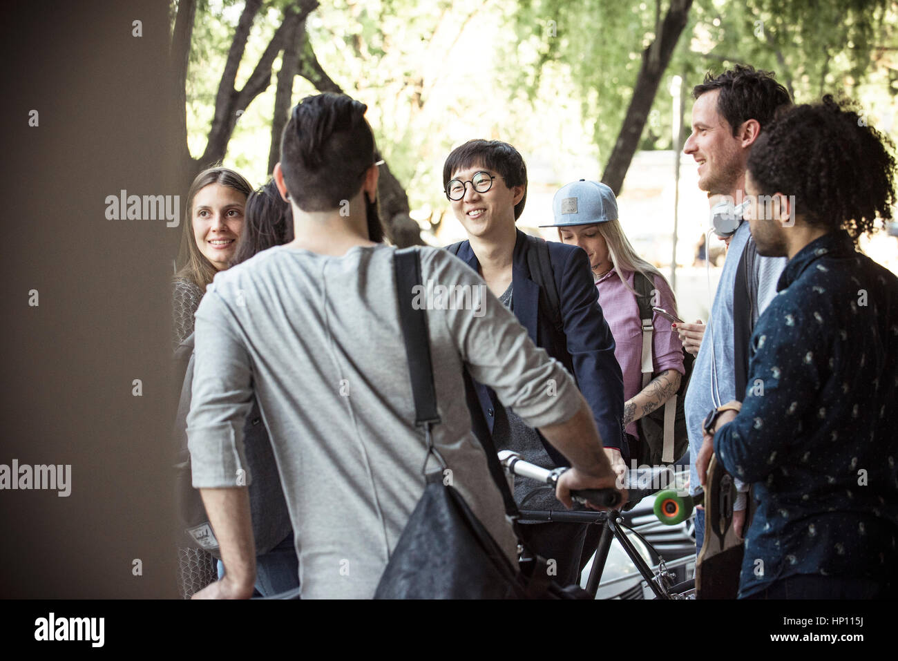 Colleagues chatting outdoors Stock Photo - Alamy