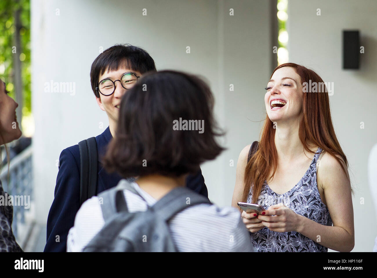 Young adults laughing campus hi-res stock photography and images - Alamy