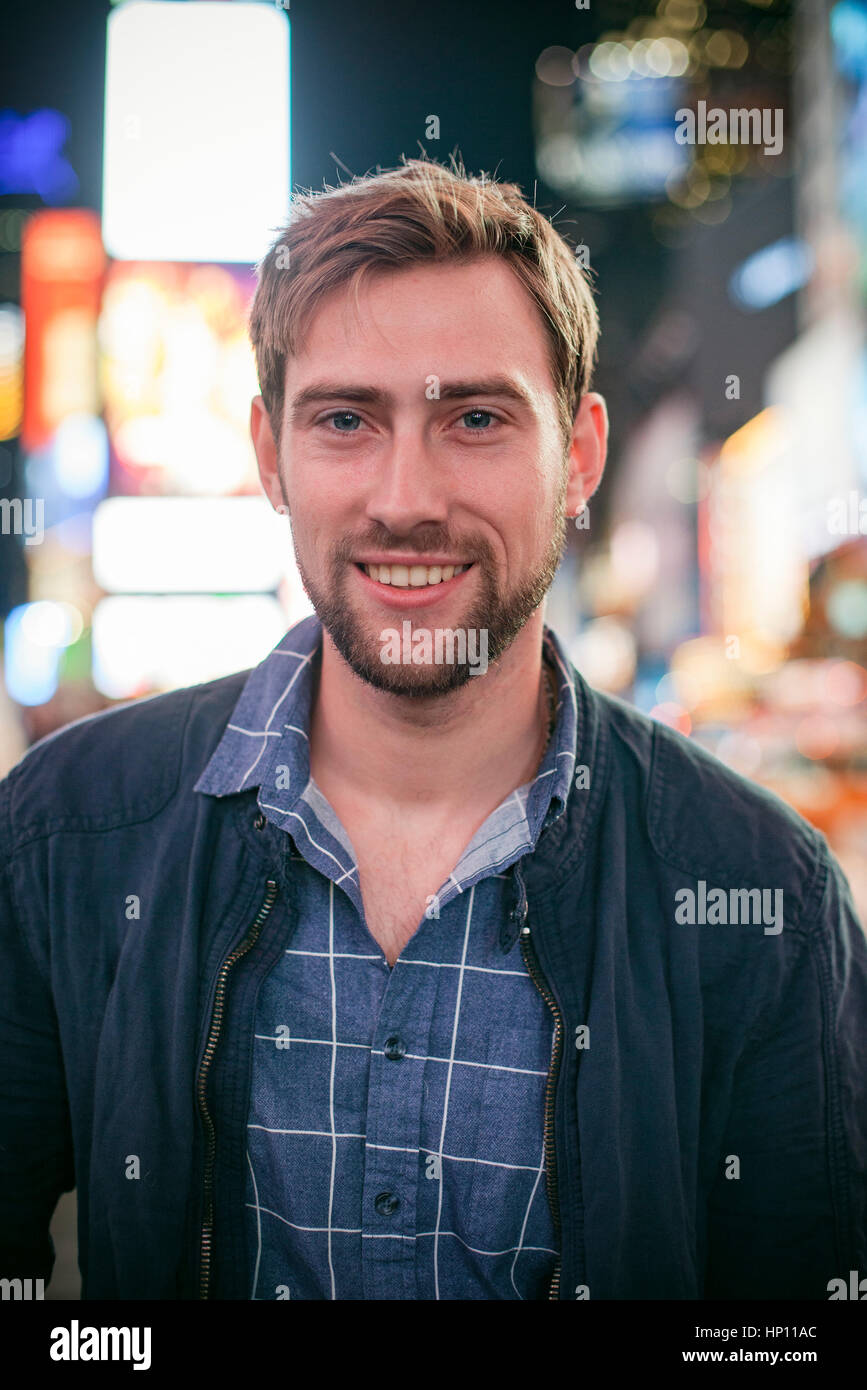 Young man on times square hi-res stock photography and images - Alamy