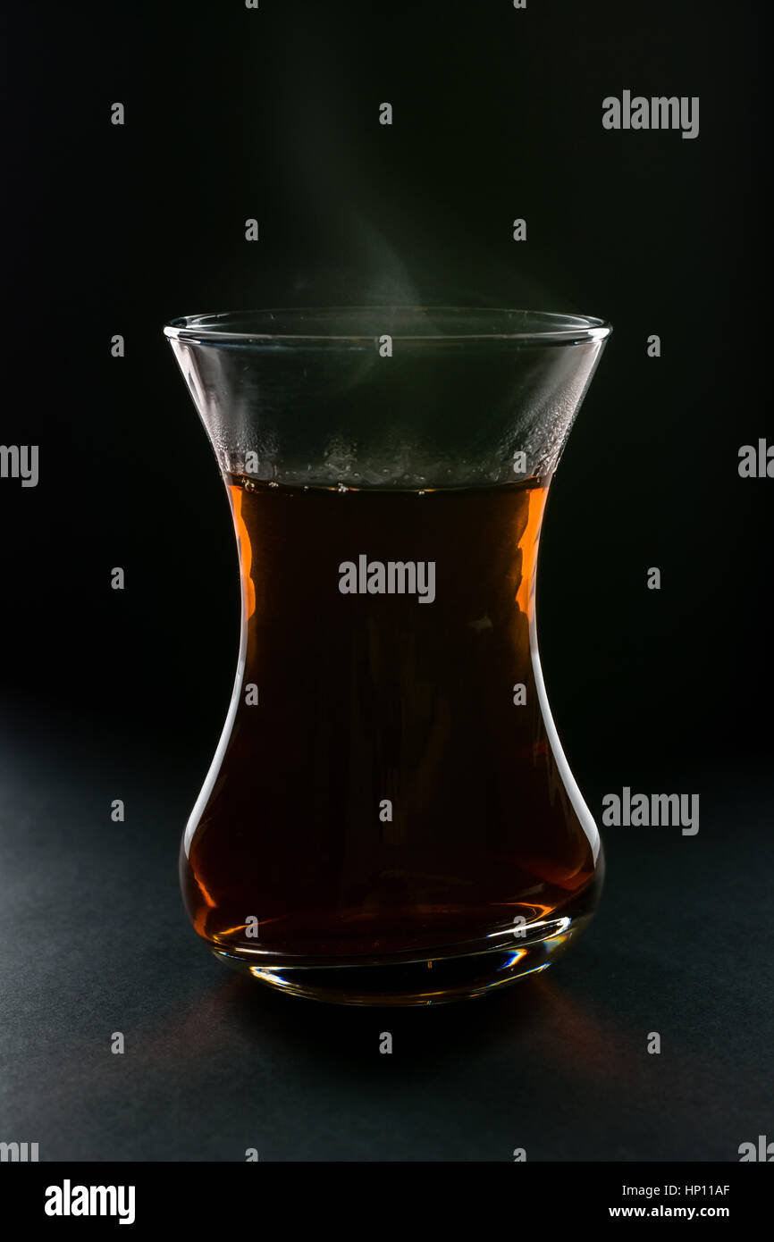 Cup of tea black background Stock Photo - Alamy
