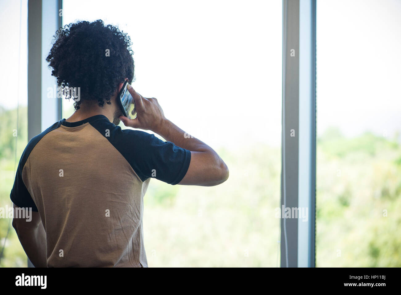 Man enjoying view while taking phone call Stock Photo - Alamy