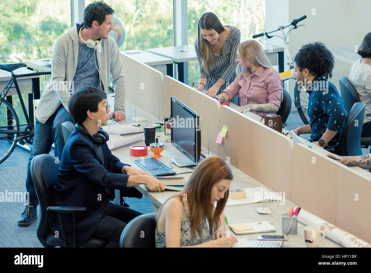 Colleagues working together in casual office Stock Photo - Alamy