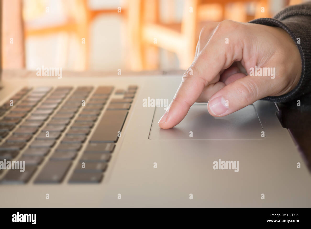 Woman's hand using touch pad of laptop, stock photo Stock Photo - Alamy