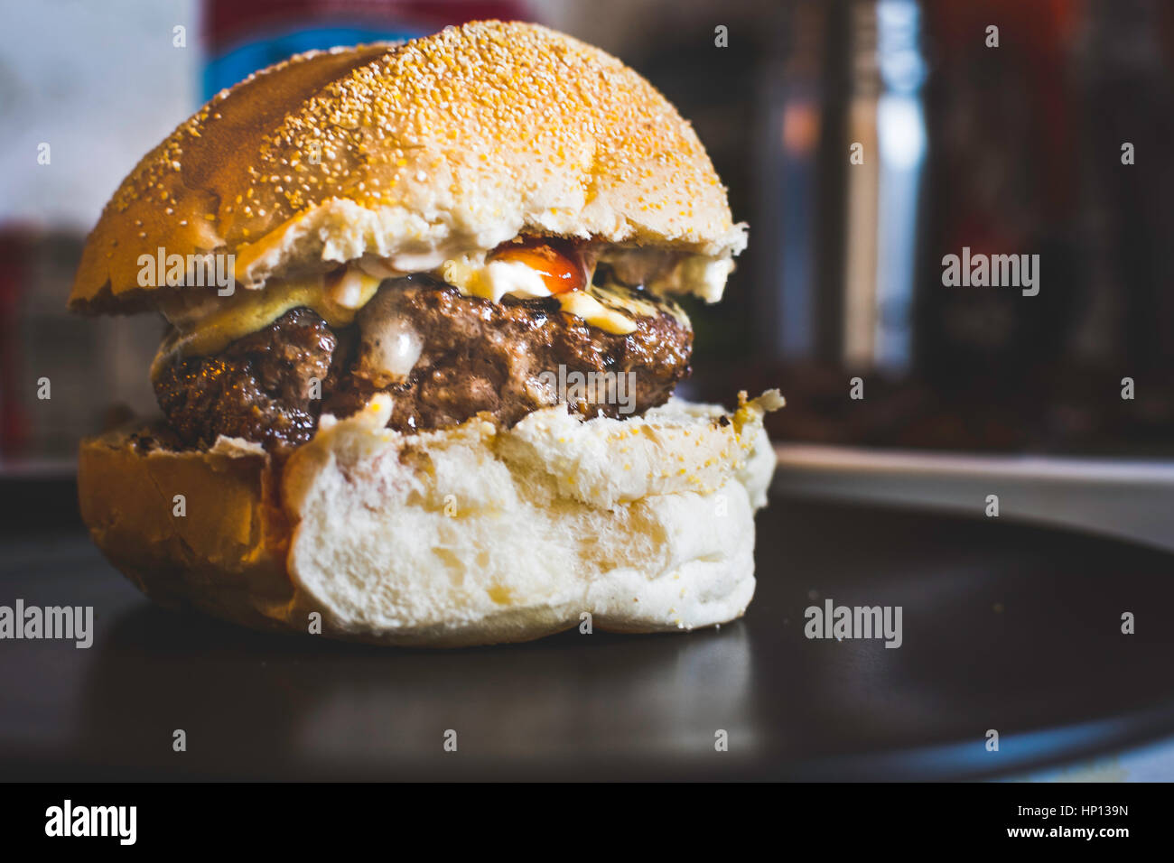 Greasy Home style cheese burger Stock Photo - Alamy