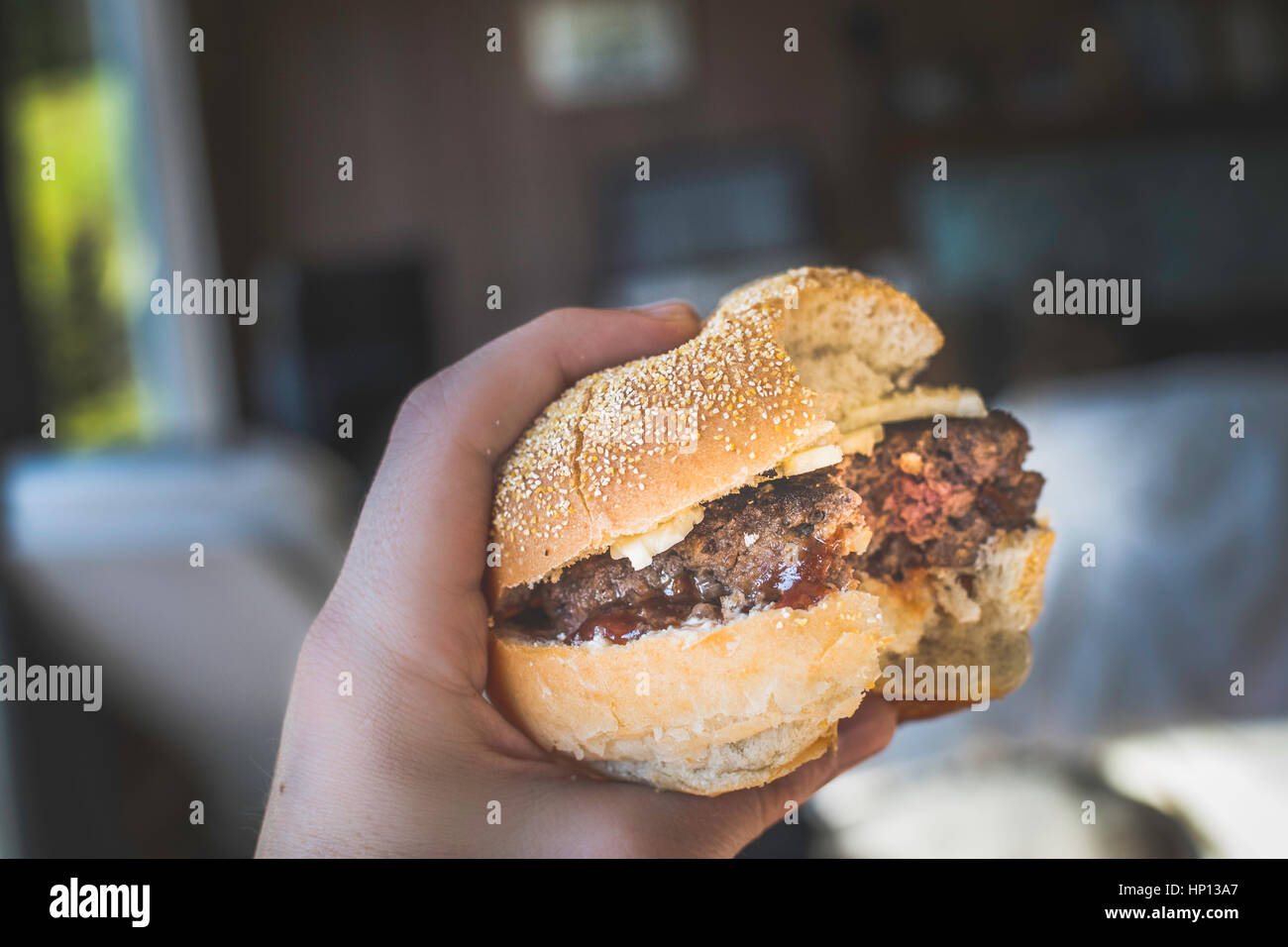 Greasy Home style cheese burger Stock Photo - Alamy
