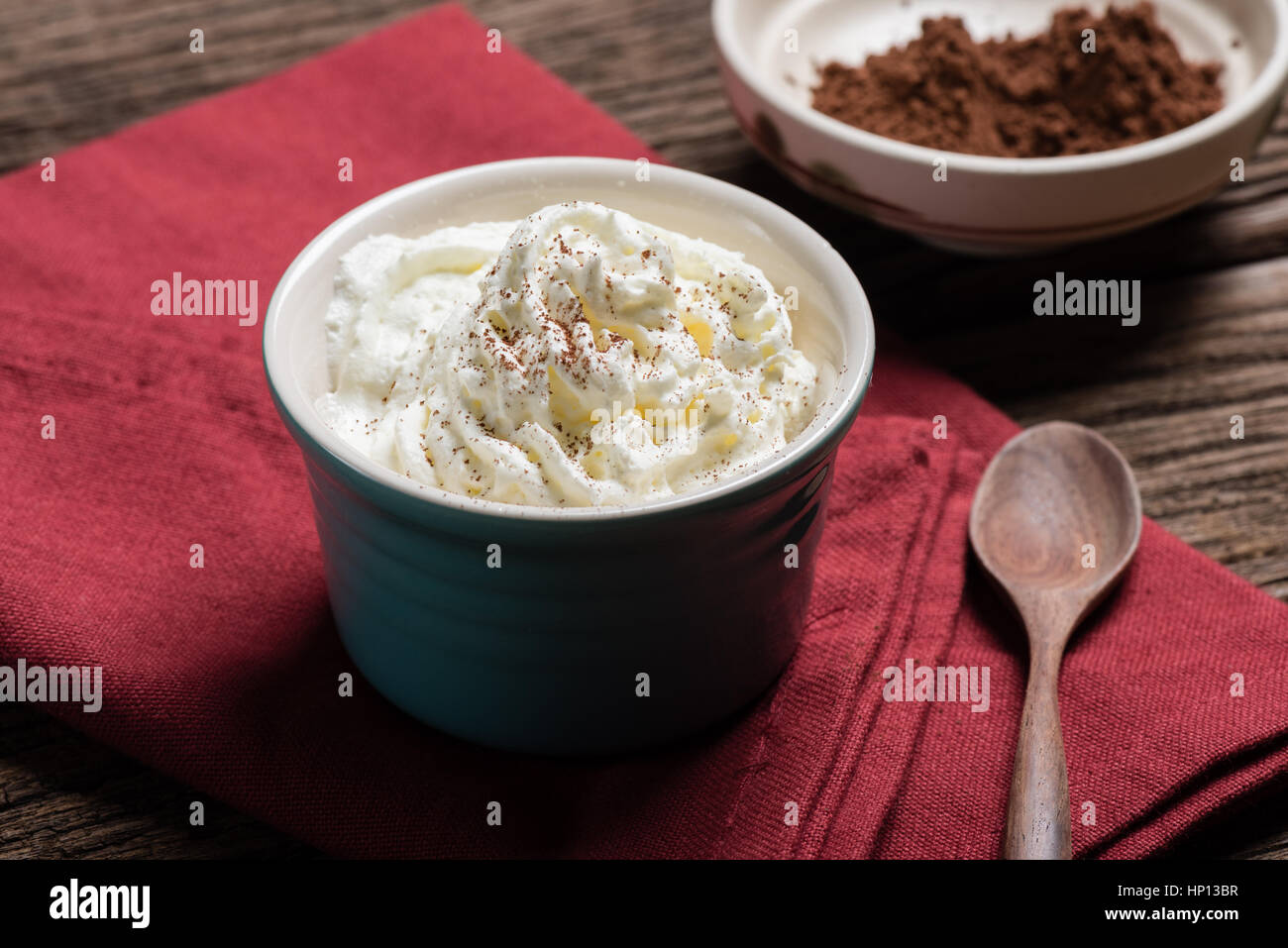 a cup of whipped cream on wooden table Stock Photo - Alamy