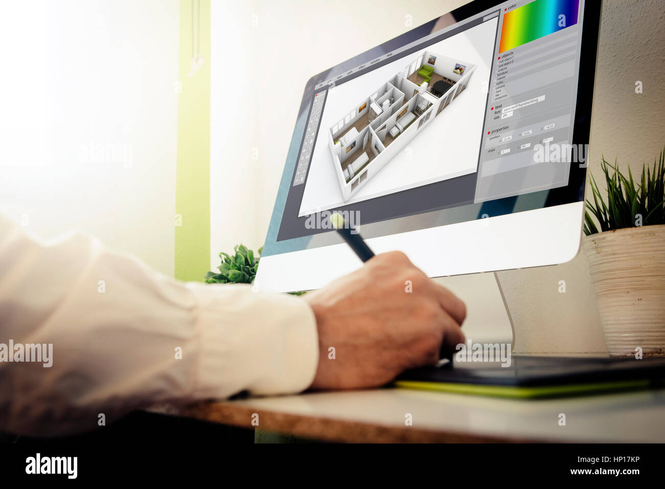 interior designer working with computer. All screen graphics are made ...