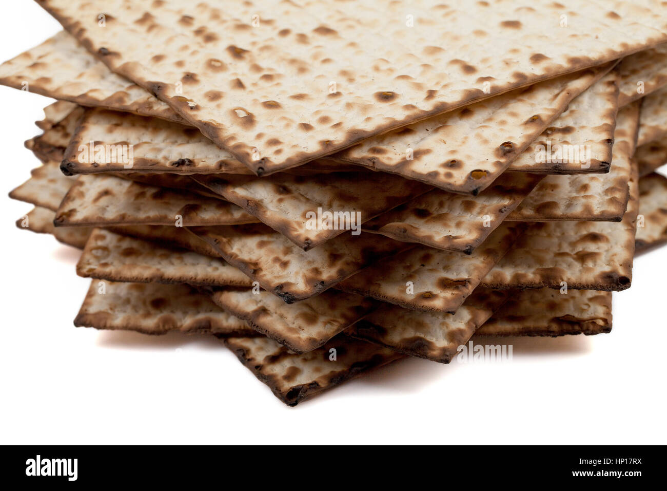 Traditional Jewish matzah on a white background. Close-up Stock Photo ...