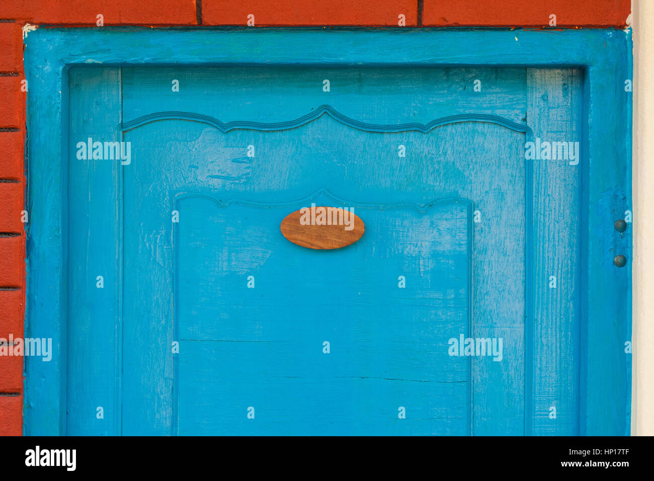 Wooden hotel room door painted blue with wood number sign Stock Photo ...