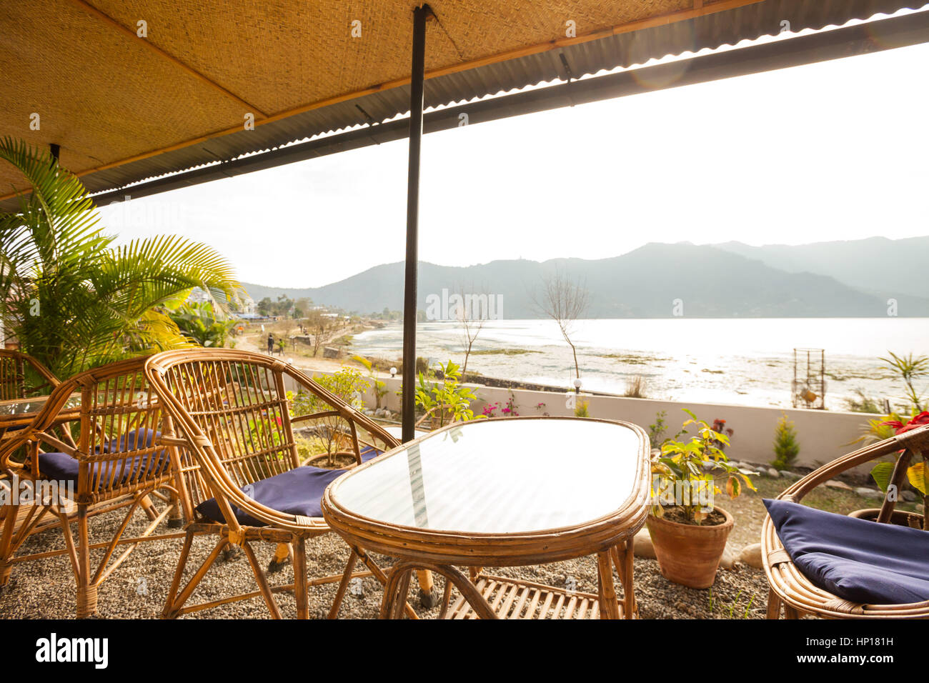 Tables at a cafe next to Fewa (Phewa) Lake, Pokhara, Nepal Stock Photo ...
