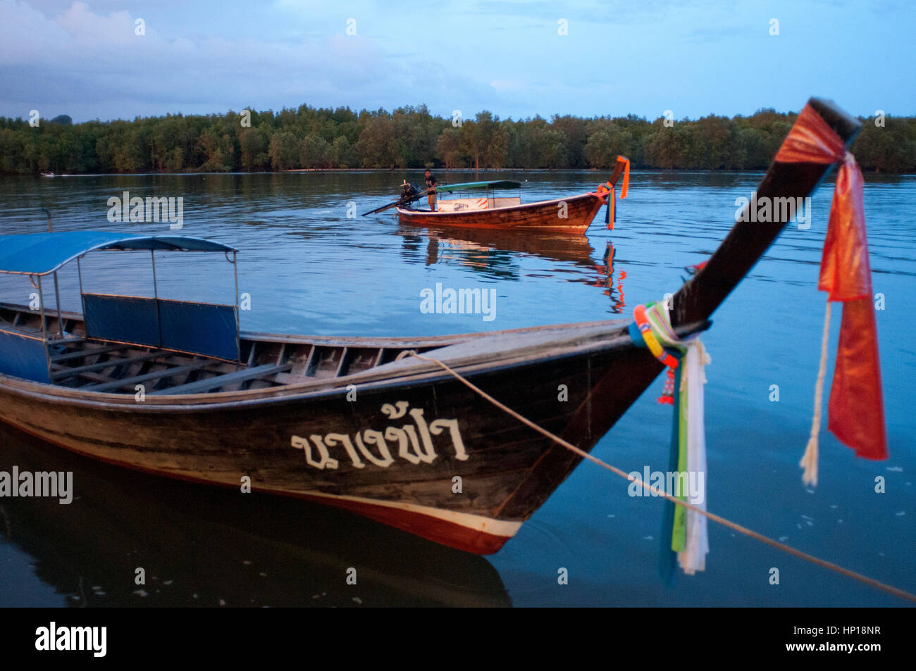 Boats in Khao Khanap Nam. Krabi River and Kanab Nam Twin Peaks in the ...