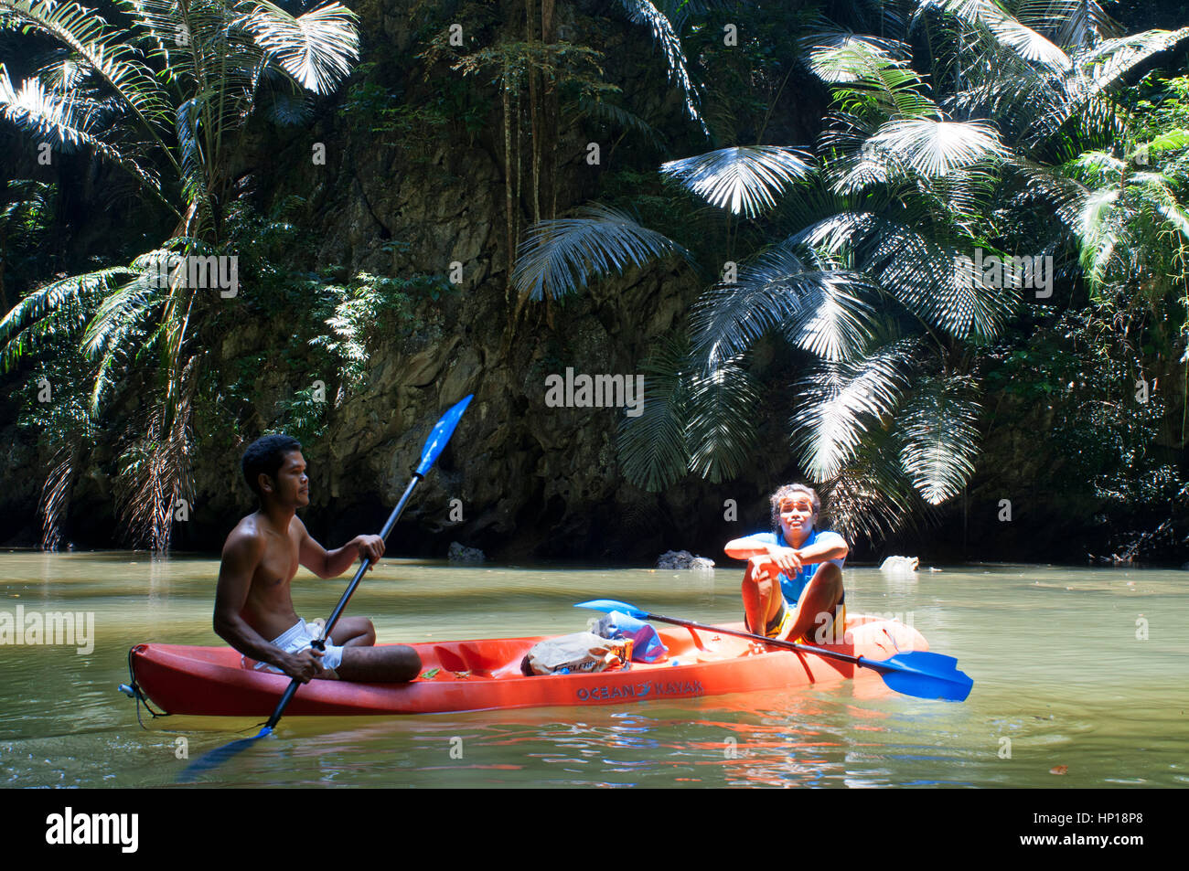 People enjoy kayak padding through the mangrove forest and sea cave ...