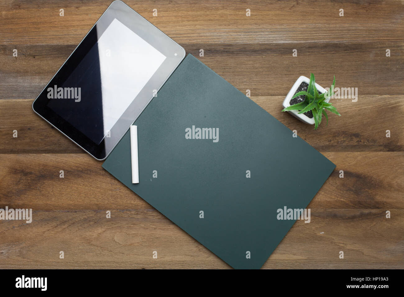 Tablet,Colorful Chalks,Chalk board and eraser on wooden background ...