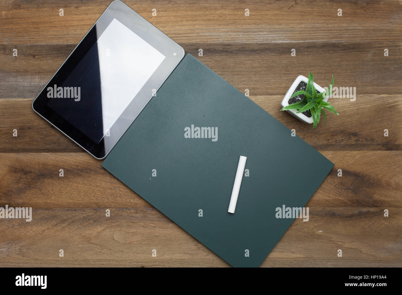 Tablet,Colorful Chalks,Chalk board and eraser on wooden background ...