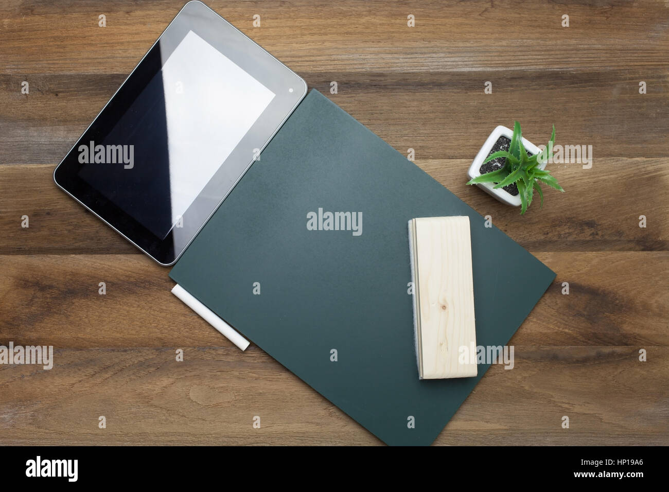 Tablet,Colorful Chalks,Chalk board and eraser on wooden background ...