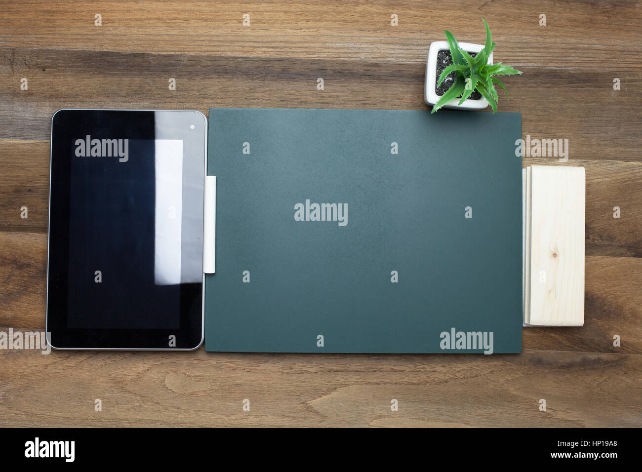Tablet,Colorful Chalks,Chalk board and eraser on wooden background ...