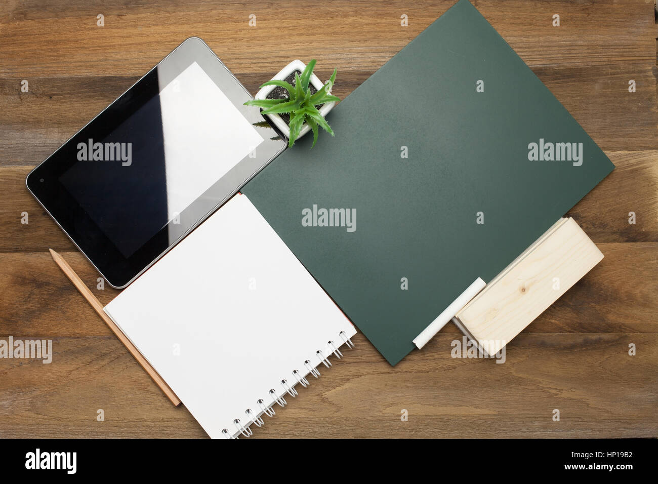 Tablet,Colorful Chalks,Chalk board and eraser on wooden background ...