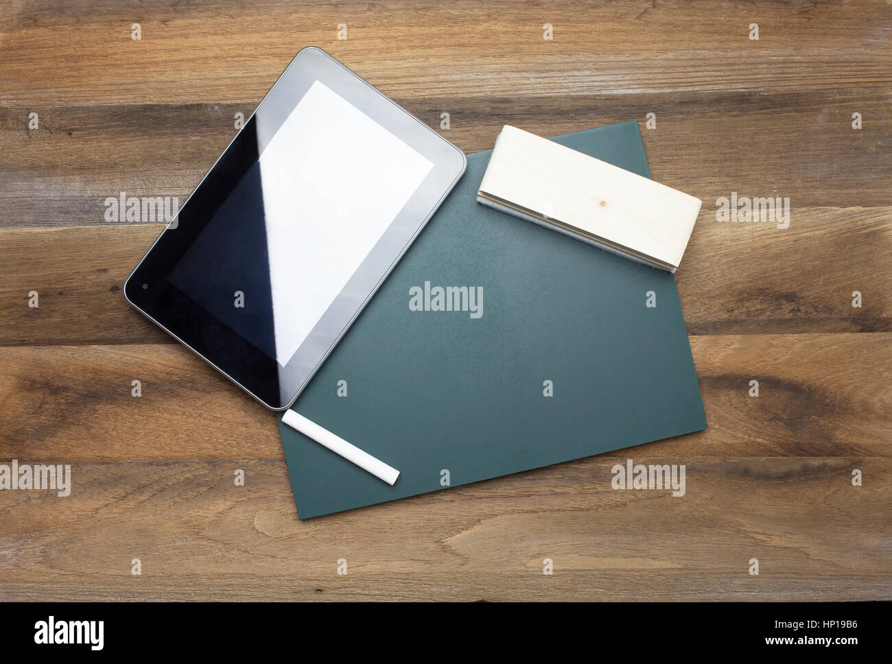 Tablet,Colorful Chalks,Chalk board and eraser on wooden background ...